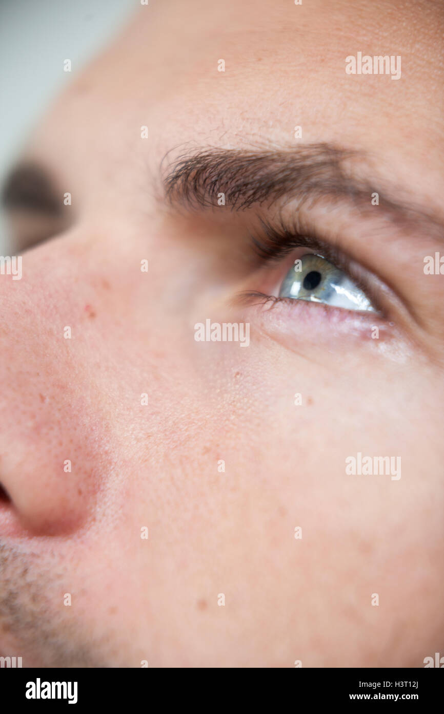 Man wearing contact lens Stock Photo - Alamy