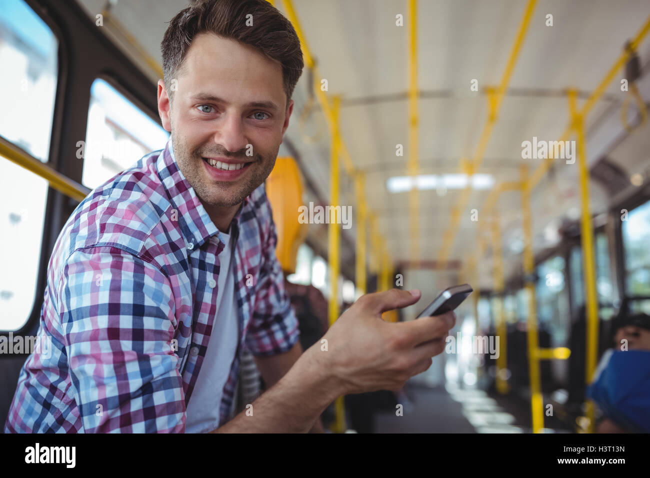 Portrait of handsome man using mobile phone Stock Photo - Alamy