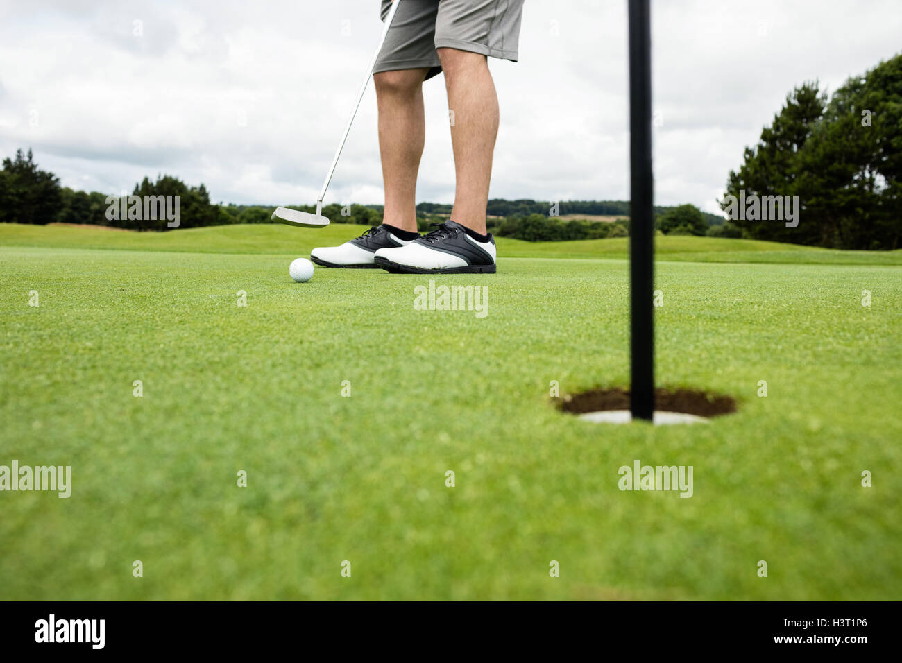 Man playing golf Stock Photo - Alamy