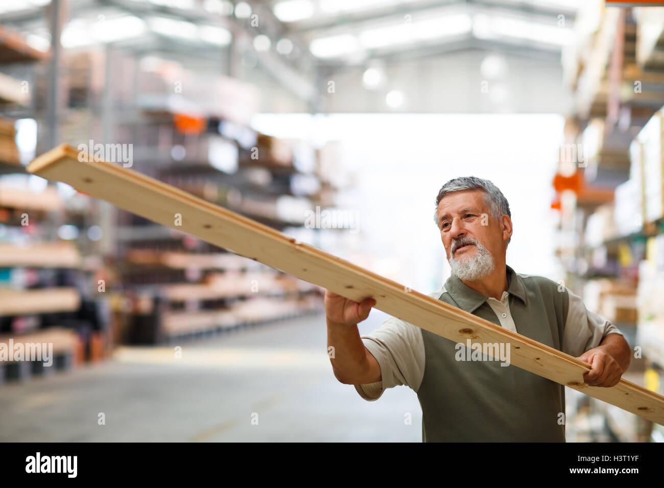 Man buying construction wood in a DIY store Stock Photo - Alamy