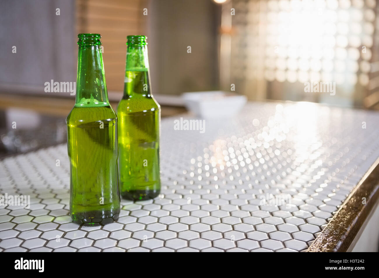 Bottle of beer on restaurant bar counter hi-res stock photography and ...