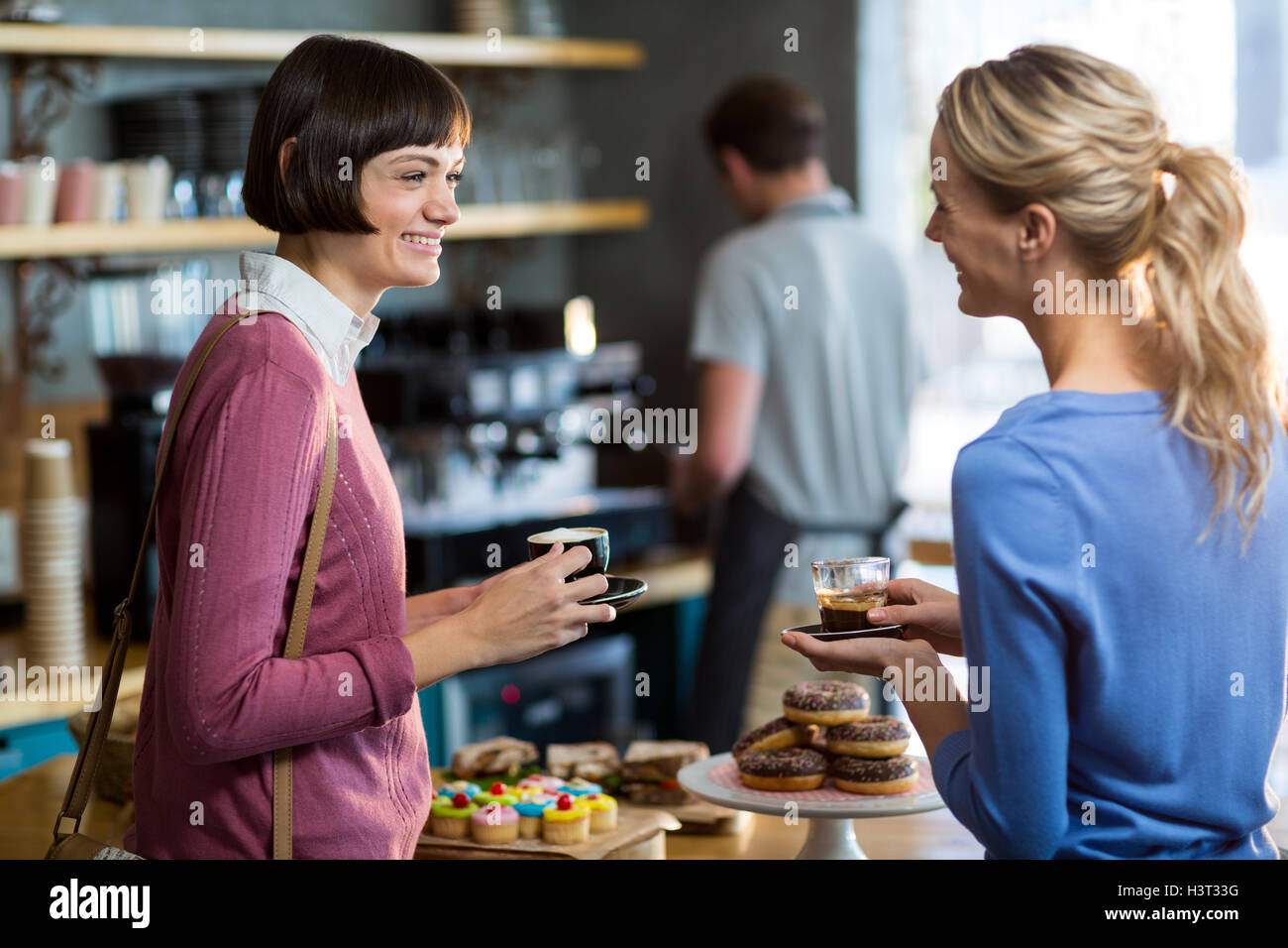 Friends having cup coffee hotel hi-res stock photography and images - Alamy