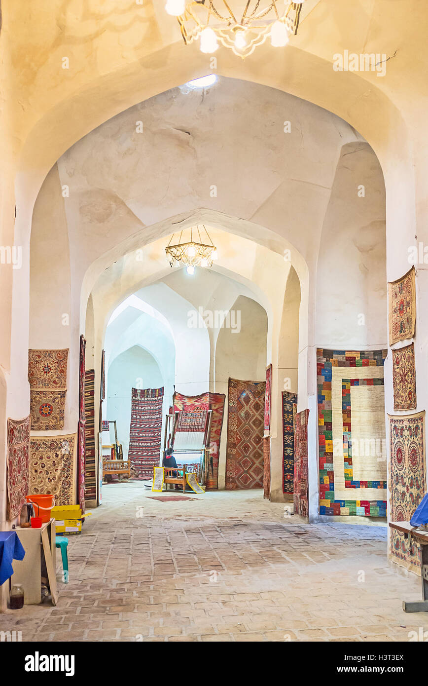 The rug store located in the medieval trading dome in Bukhara Stock ...