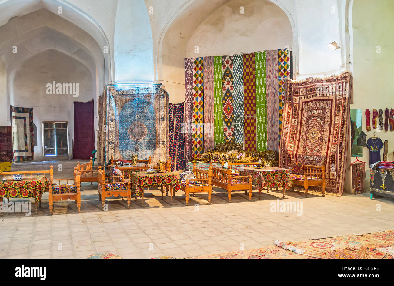 The tourist cafe in the middle of the old rug workshop in Bukhara Stock ...