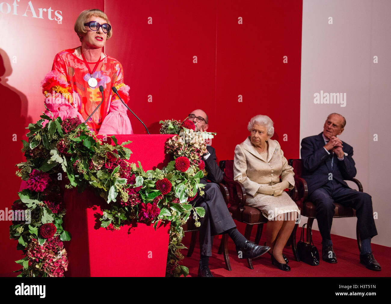 Queen Elizabeth II and the Duke of Edinburgh (right) listen to Grayson ...