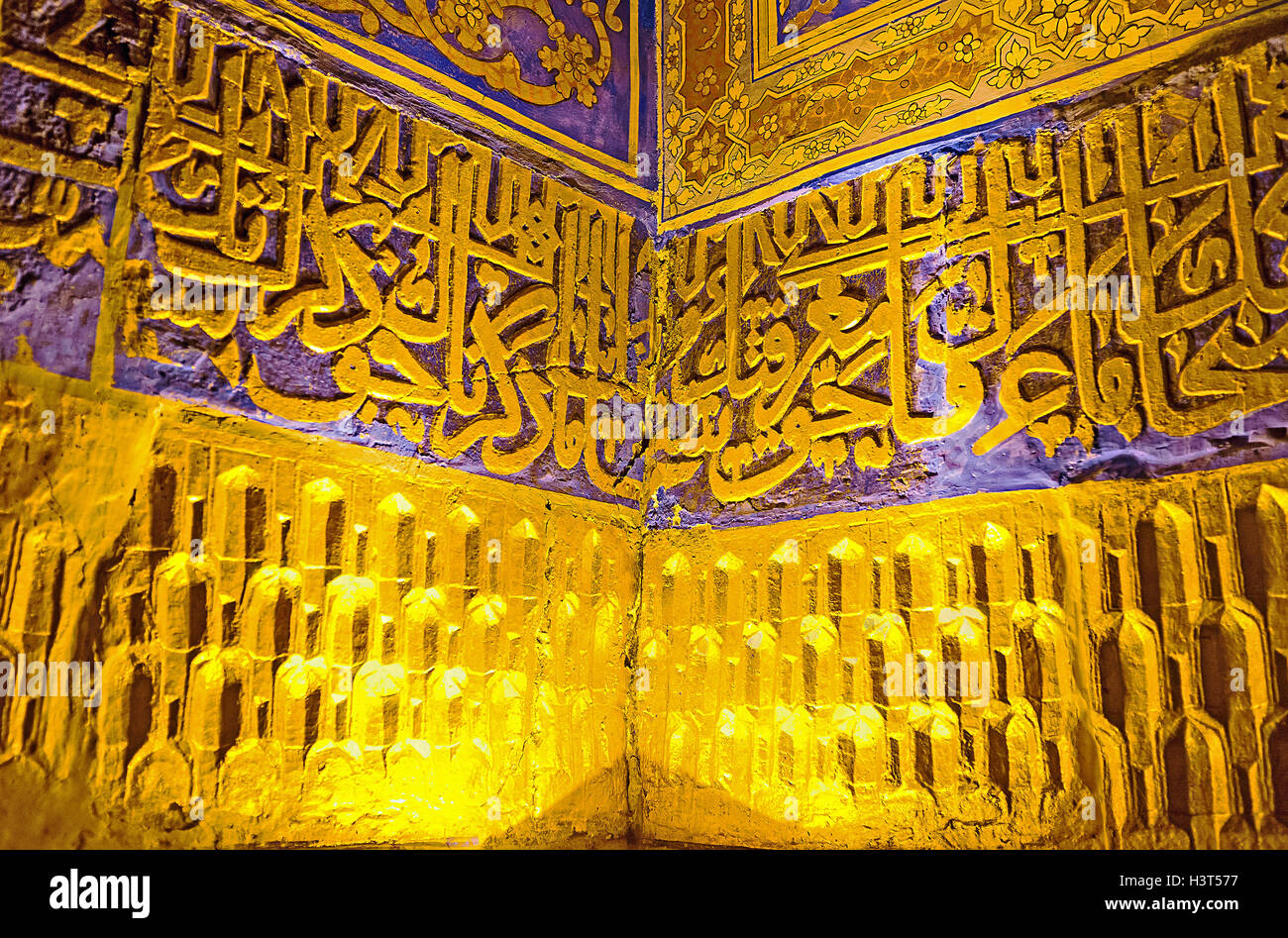The wall of Tilya Kori Madrasah decorated with the persian hieroglyphs ...