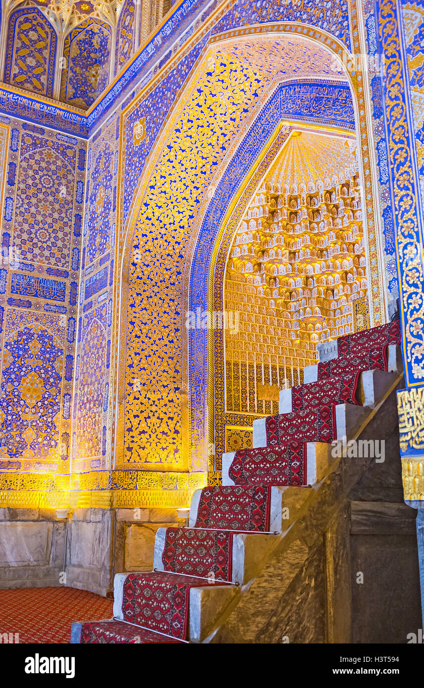 The mihrab in mosque of Tilya Kori Madrasah decorated with numerous ...