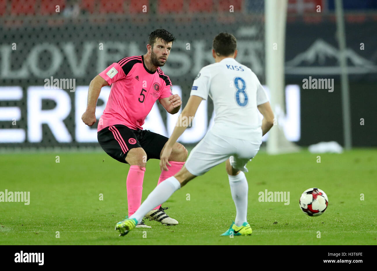 Scotland's Grant Hanley (left) and Slovakia's Filip Kiss (right) battle ...