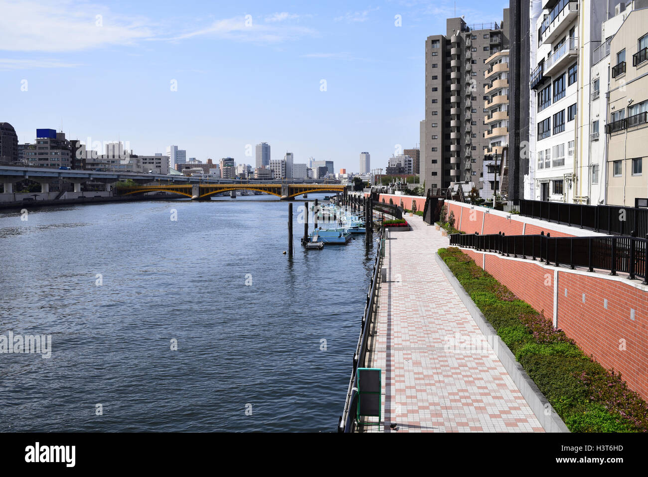 Kachidoki Bridge and Sumida River flowing through Tokyo, Japan Stock ...