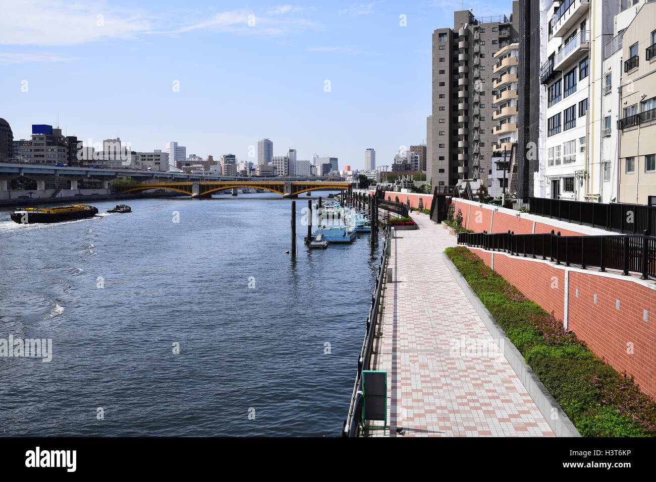 Kachidoki Bridge and Sumida River flowing through Tokyo, Japan Stock ...