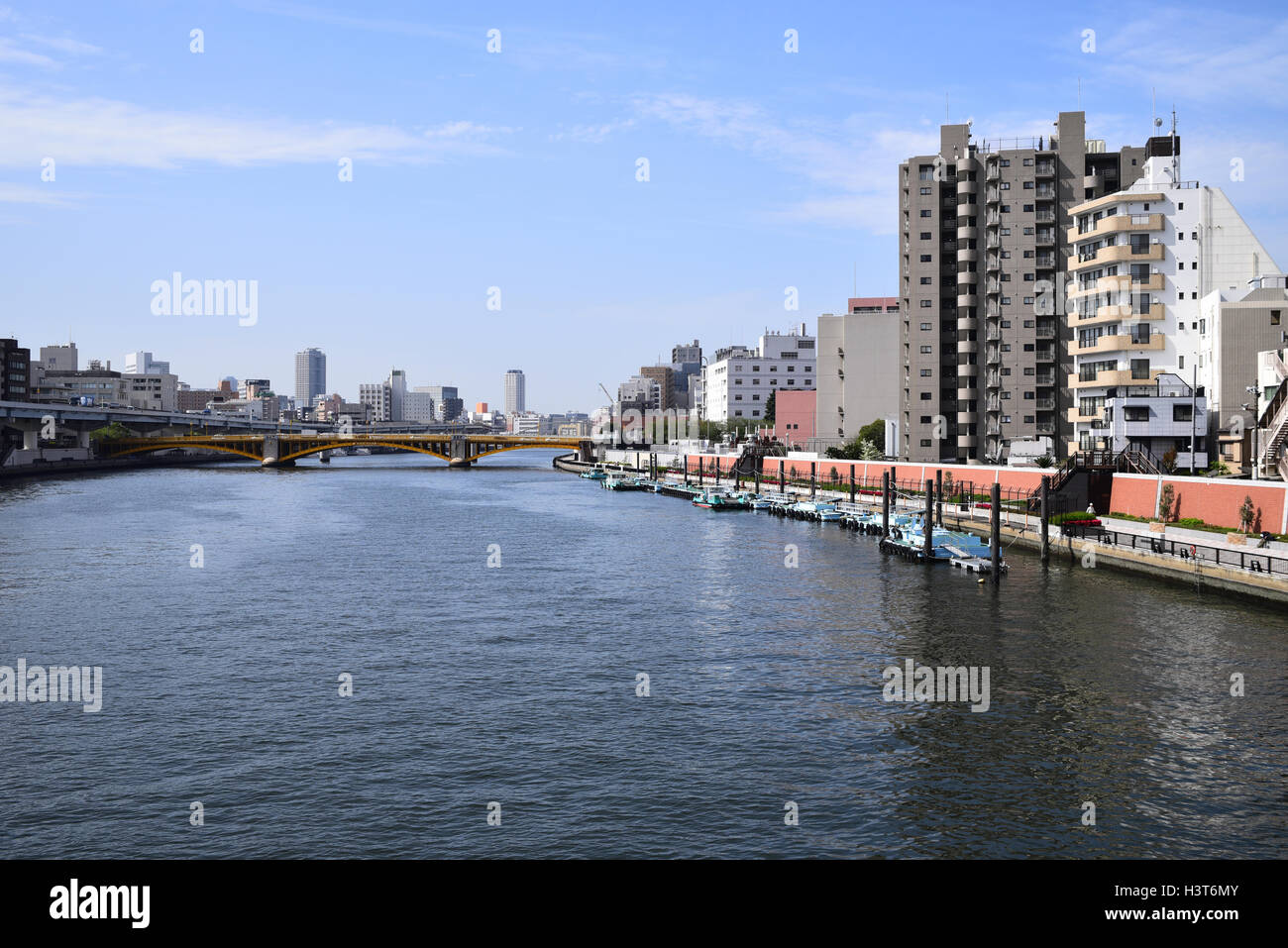 Kachidoki Bridge and Sumida River flowing through Tokyo, Japan Stock ...