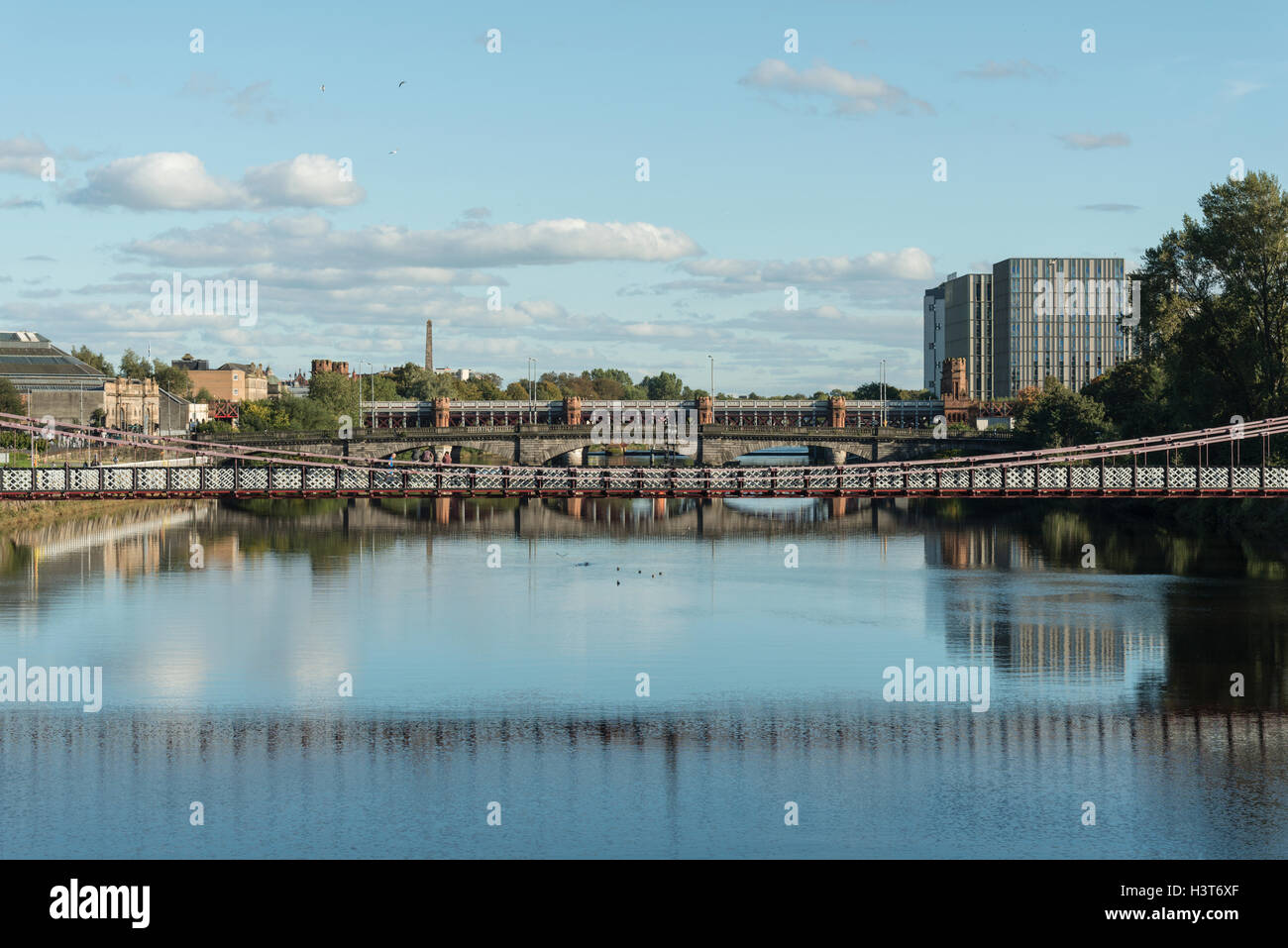 Pedestrian,road and rail bridges over river Clyde in city centre ...