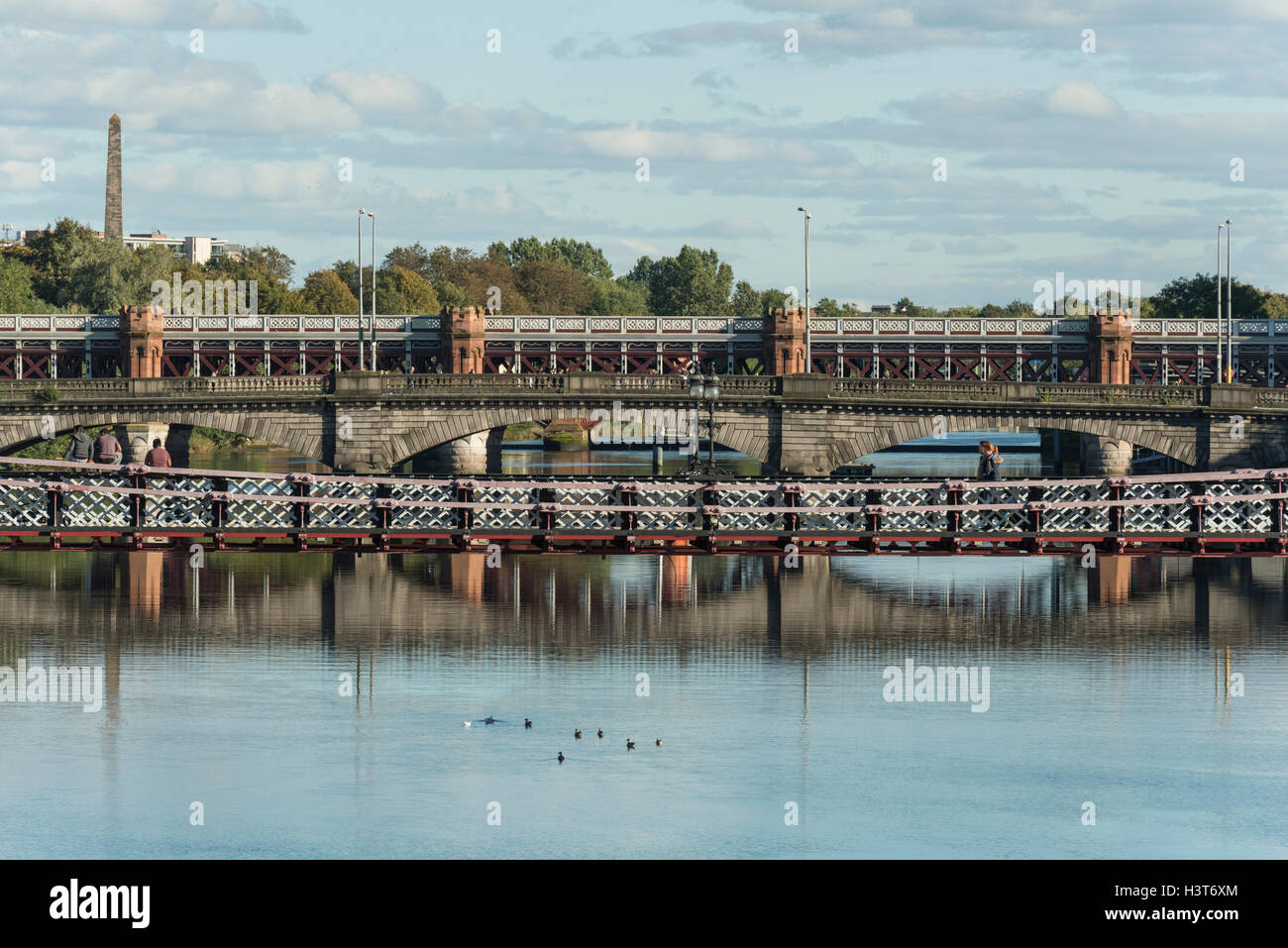 Pedestrian,road and rail bridges over river Clyde in city centre ...