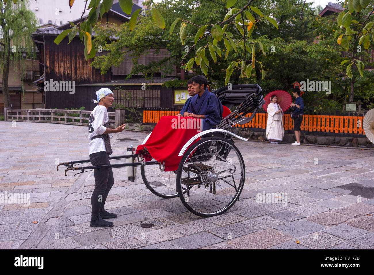 Customers talking whilst on traditional Japanese Rickshaw Stock Photo ...