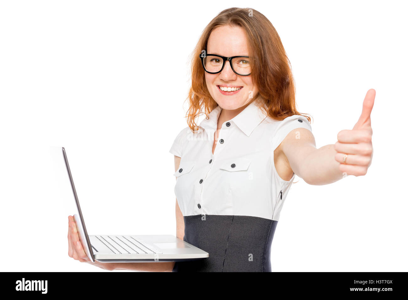 successful woman with a laptop holding a thumb up in isolation Stock ...
