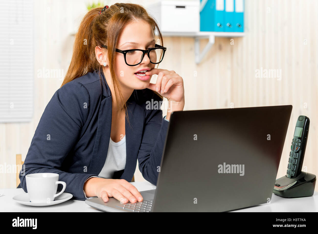 the administrator runs the Internet on a laptop in the office, close-up ...