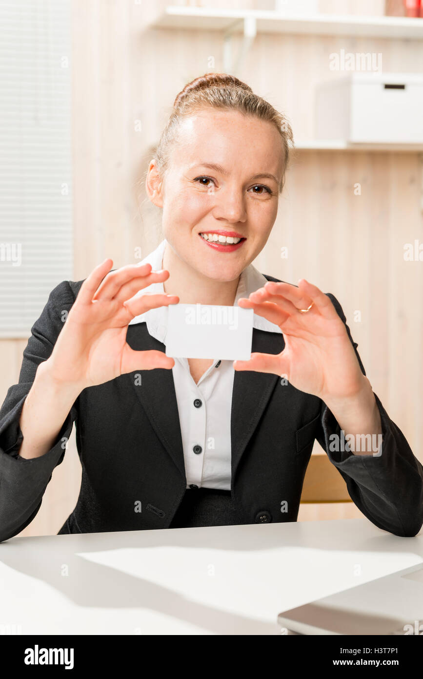portrait of a boss with a business card in his hand in the office Stock ...