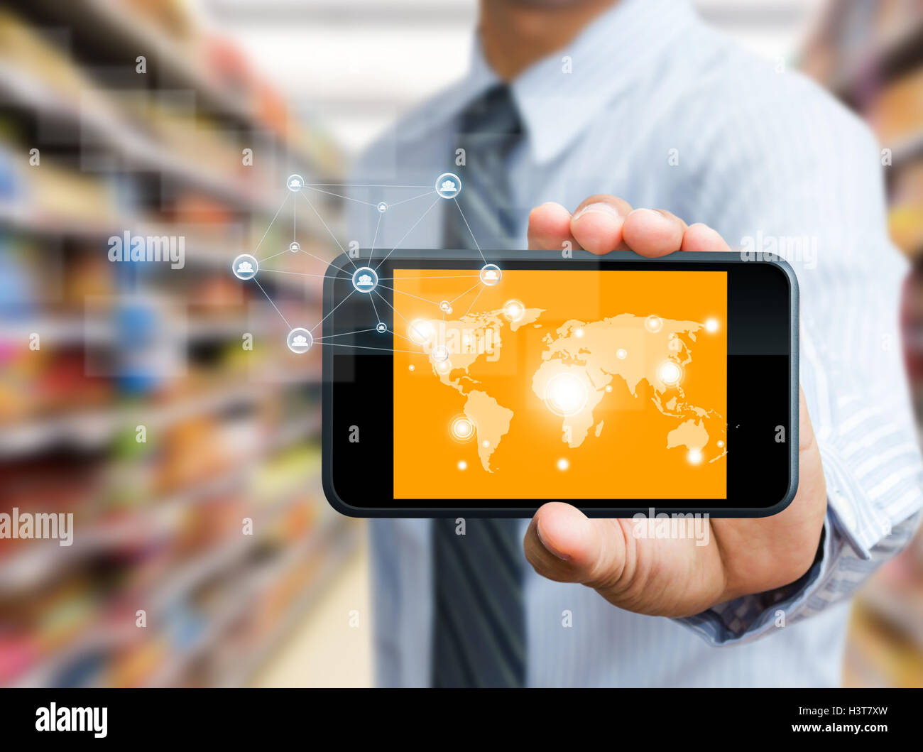 businessman holding mobile phone with world map Stock Photo - Alamy