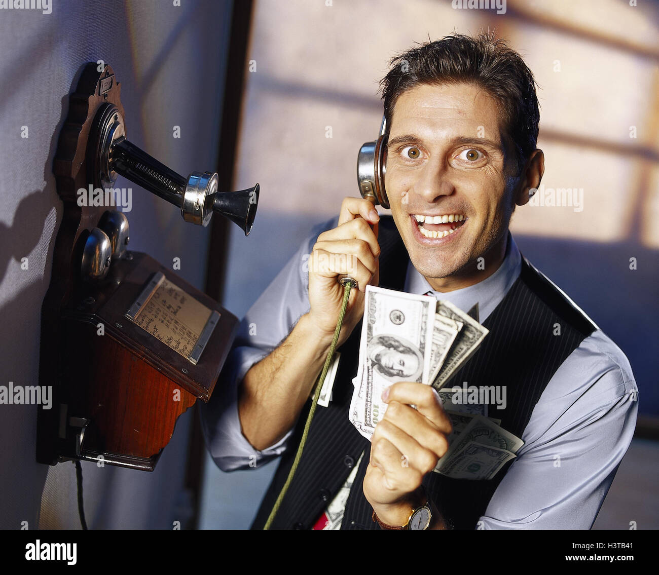 Nostalgia, man, call up, hold banknotes, facial play, joy, laugh, half ...