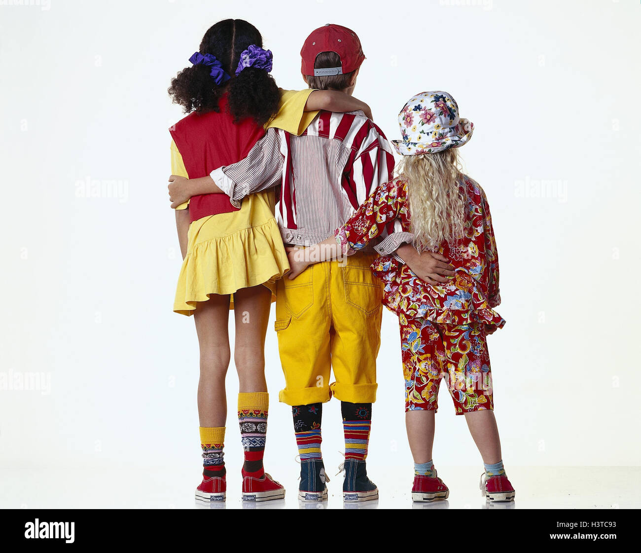 three children, arm in arm, back view, studio mb 233 A5 Stock Photo - Alamy