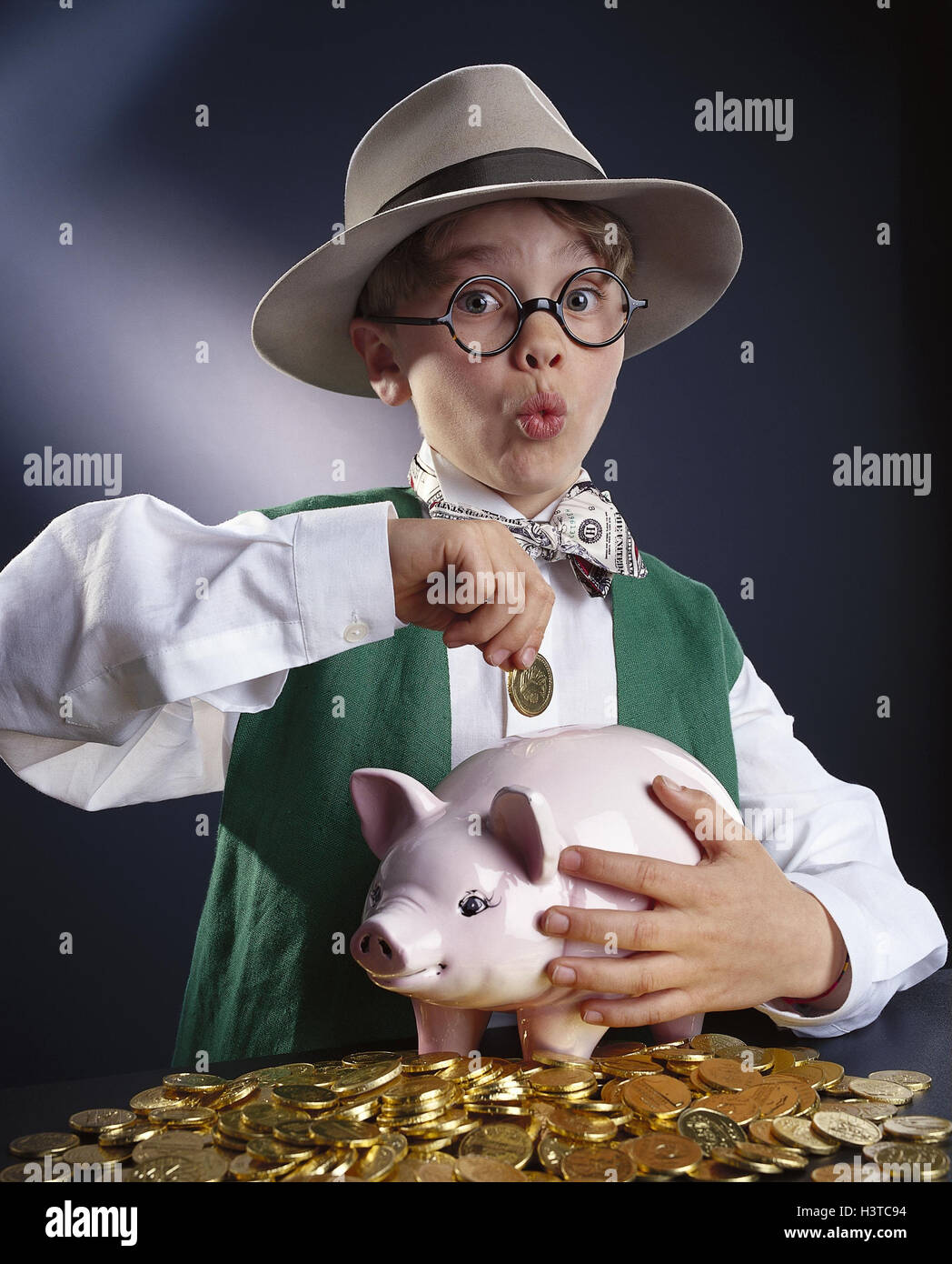 Boy, care, glasses and fly, throws money in piggy bank, facial play mb ...