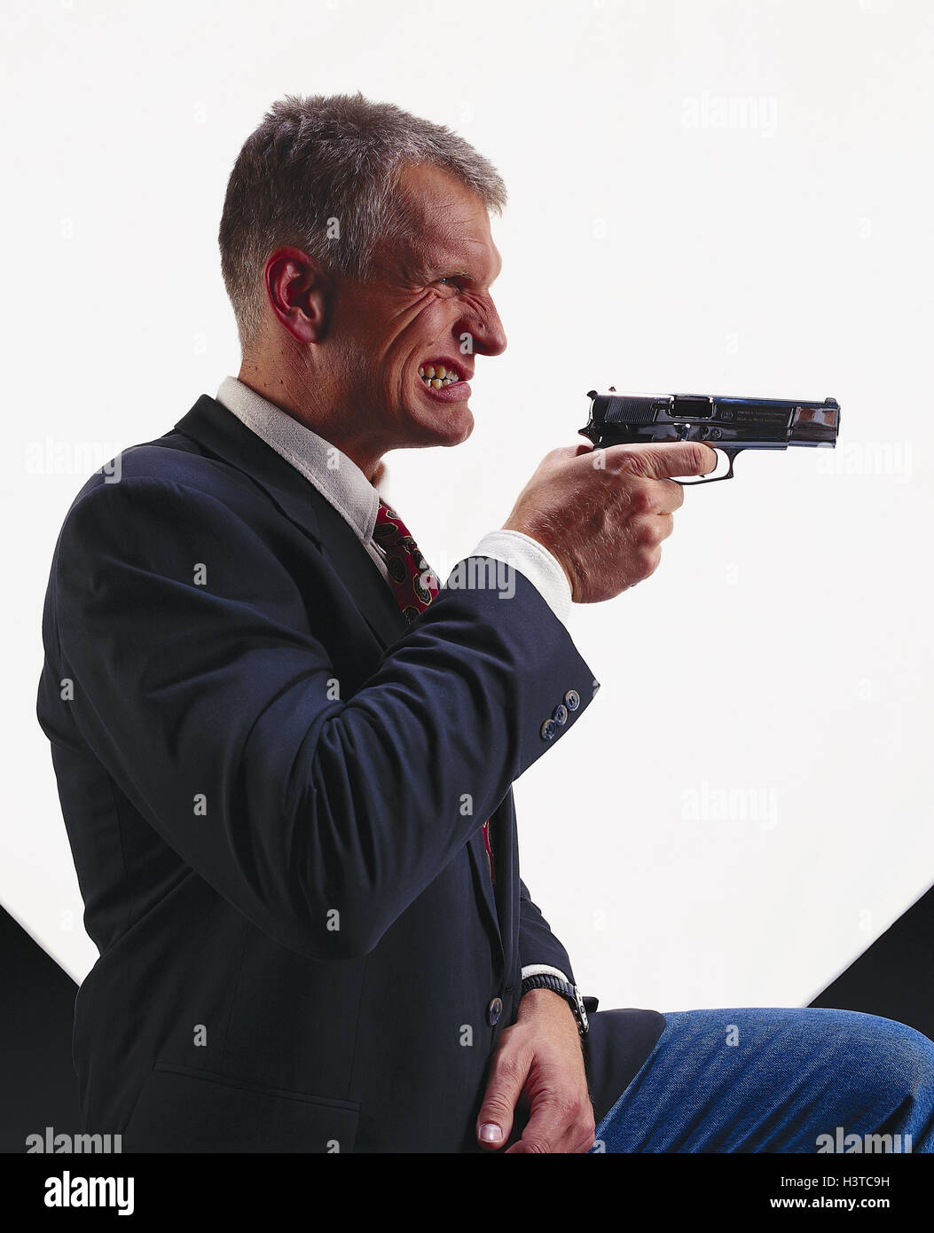 Man Suit Gun High Resolution Stock Photography and Images - Alamy