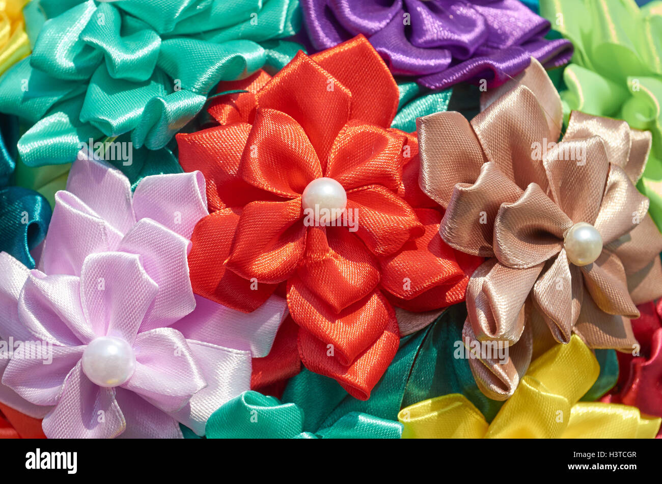 Homemade artificial colored flowers close up Stock Photo - Alamy