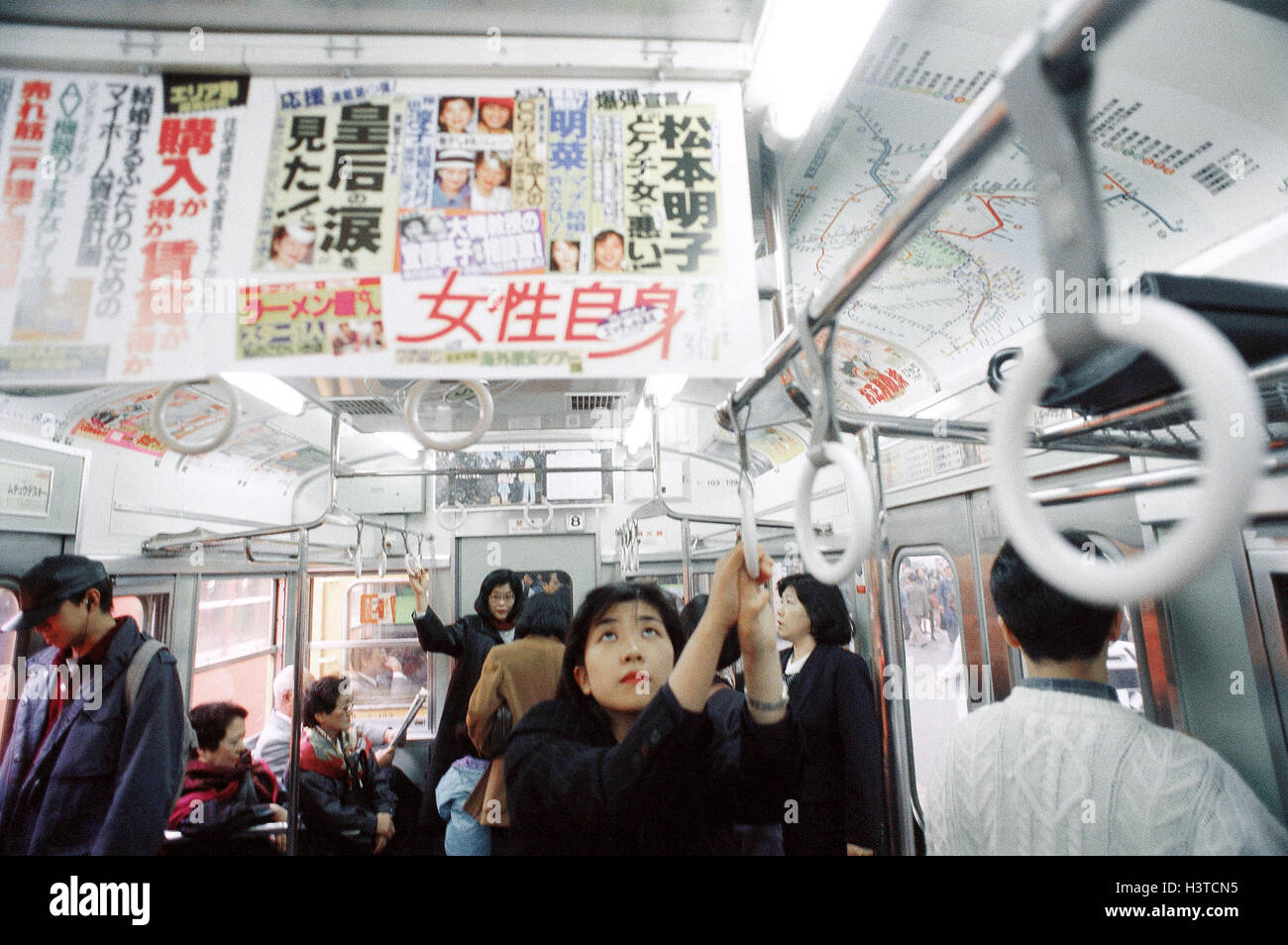 Japan, Honshu, Tokyo, city railroad, passengers, advertising signs, no ...