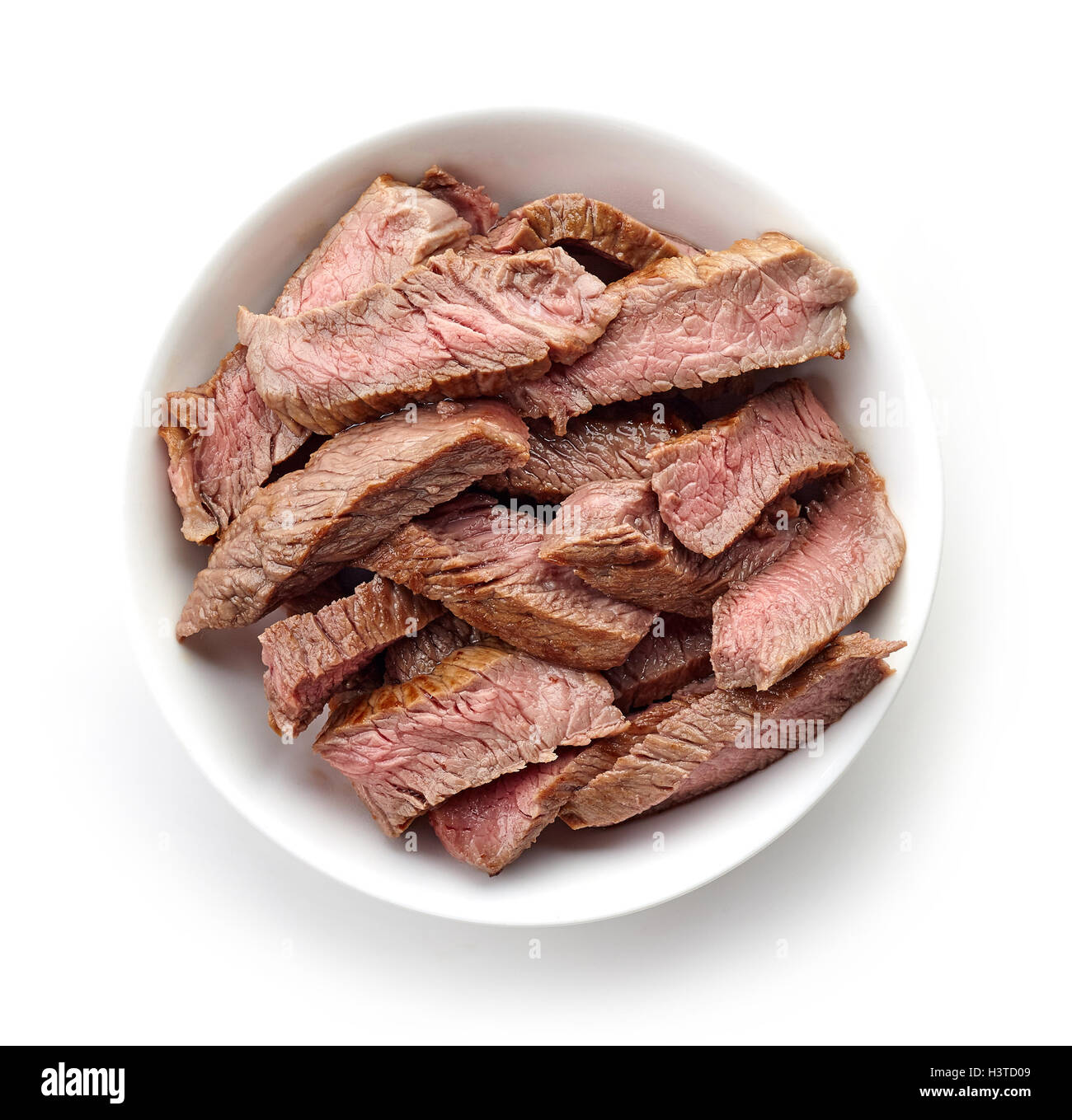 Bowl of grilled beef slices isolated on white background, top view ...
