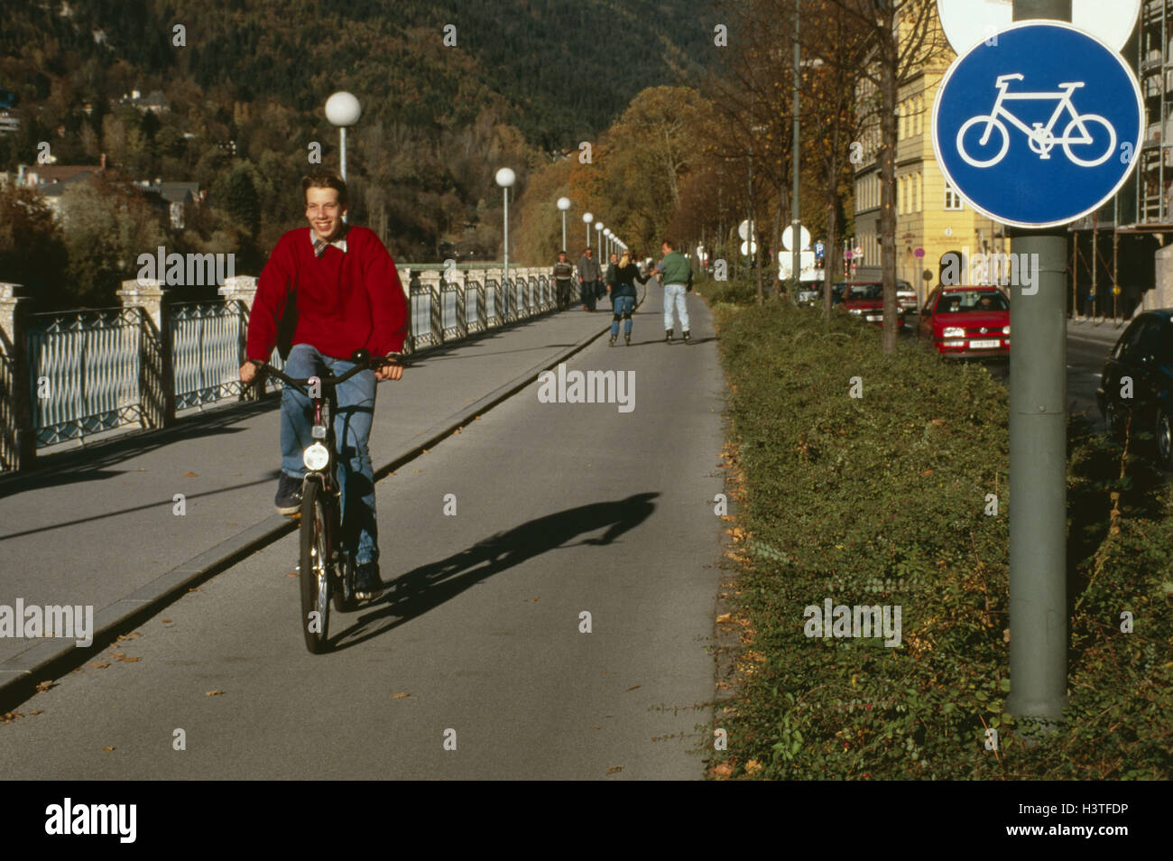 Town, cycle track, cyclist, traffic sign, teenager, young person ...