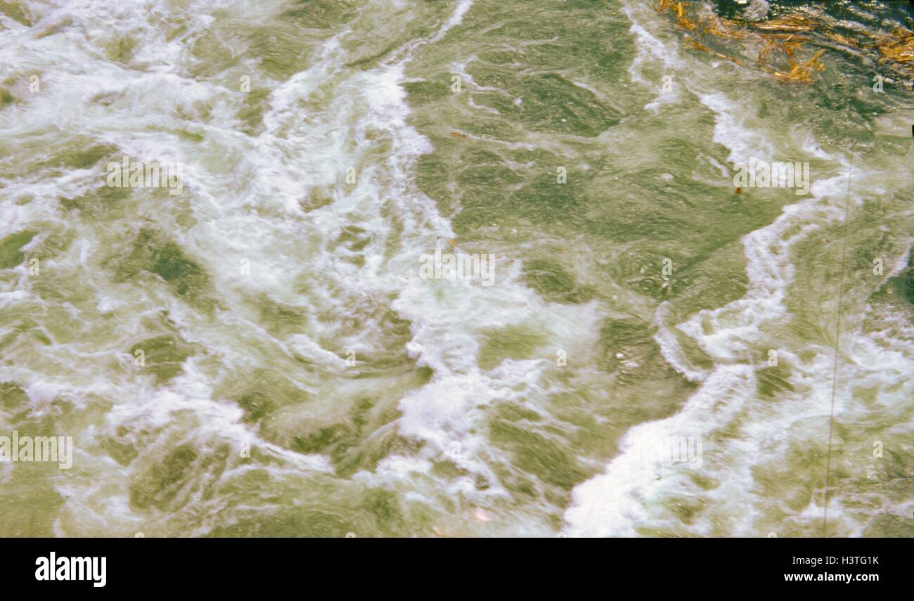 Unknown City, United States - January 01, 1960: Rapidly moving water in ...