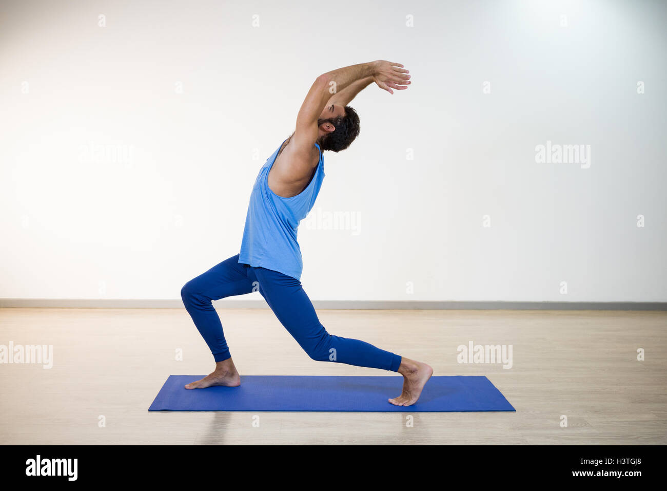 Man performing yoga Stock Photo - Alamy