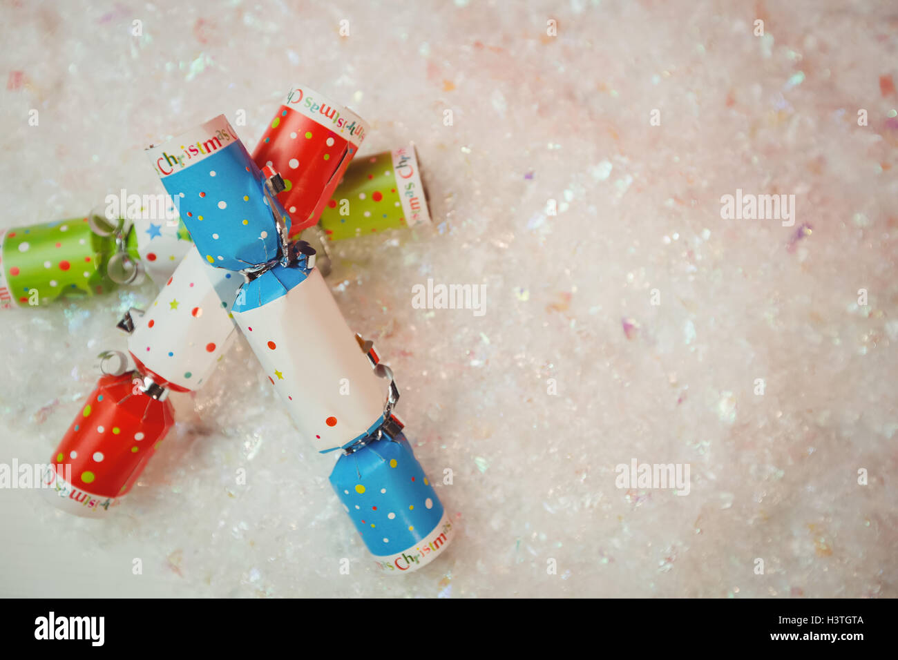 Close-up of christmas crackers on snow Stock Photo - Alamy