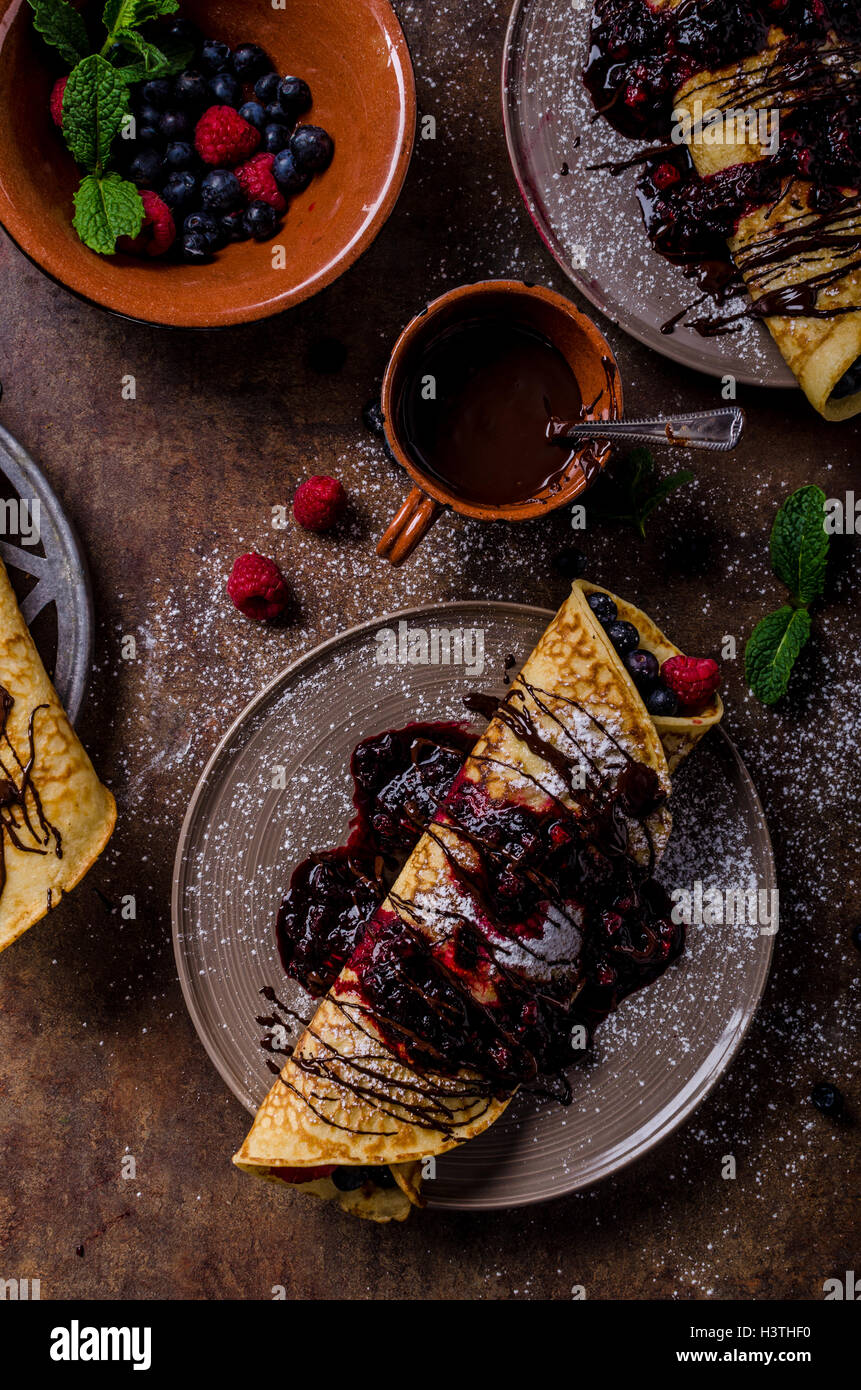 Delicious crepes with forest fruit, topped and filled with forest fruit ...