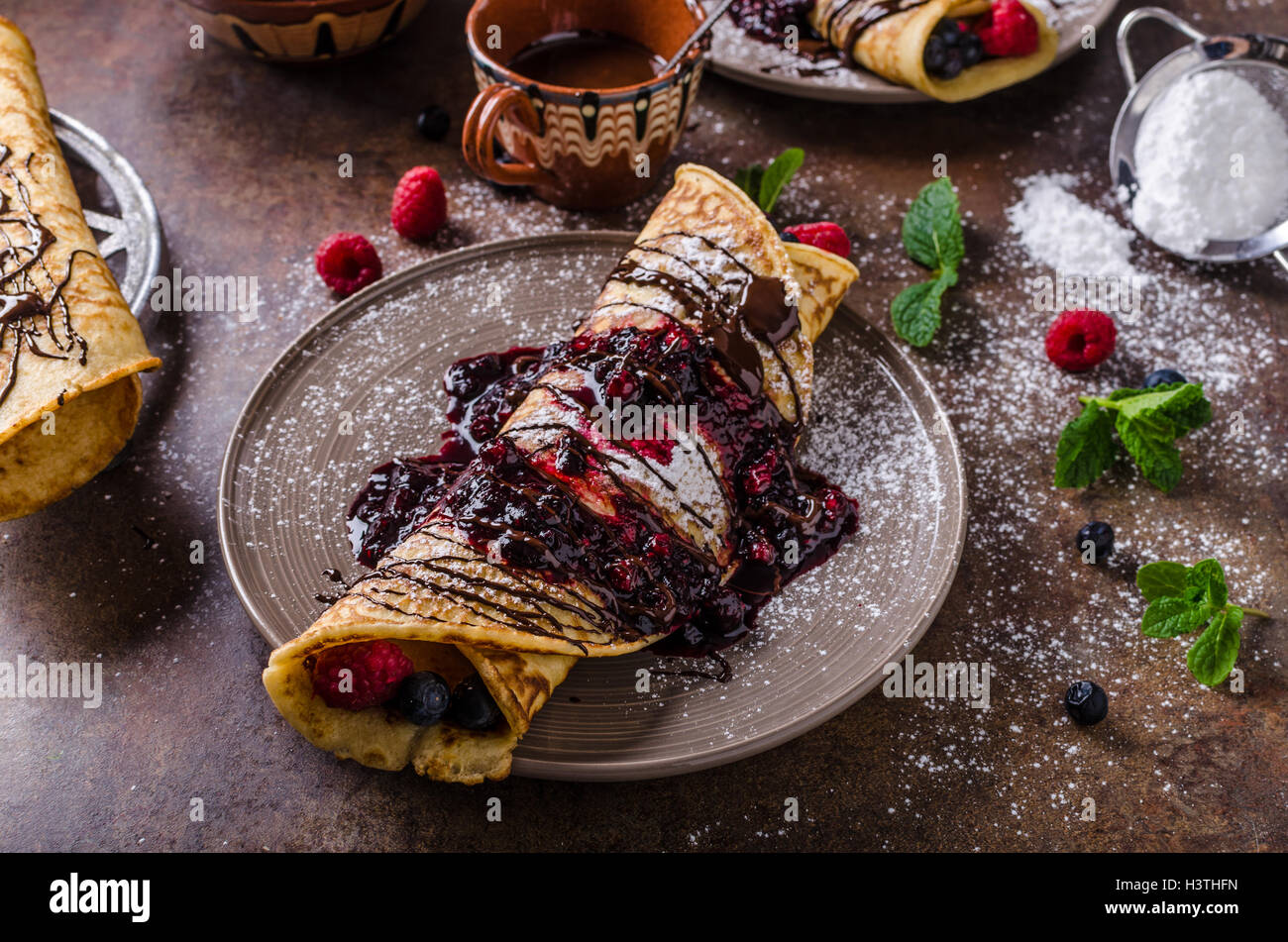 Delicious crepes with forest fruit, topped and filled with forest fruit ...