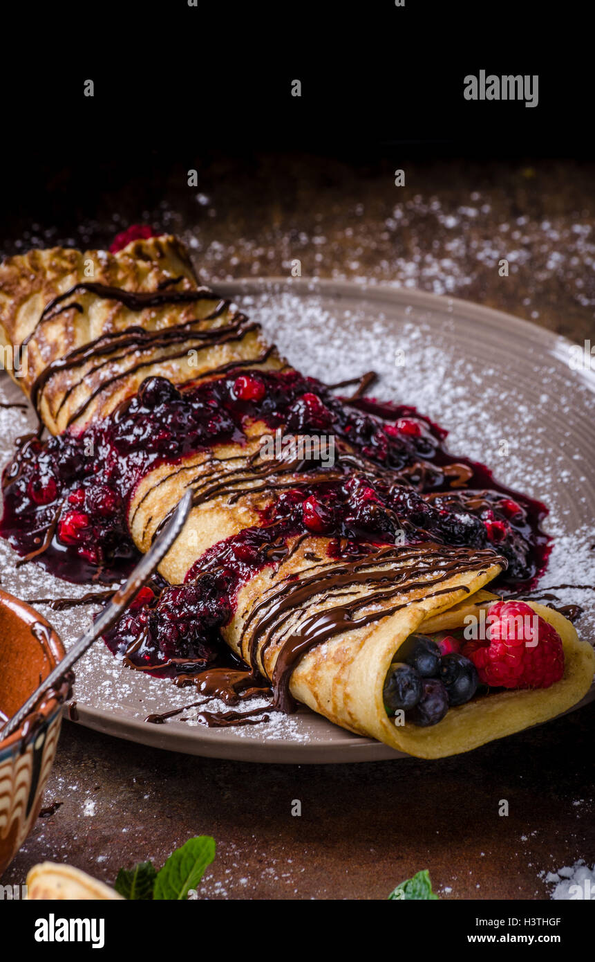 Delicious crepes with forest fruit, topped and filled with forest fruit ...