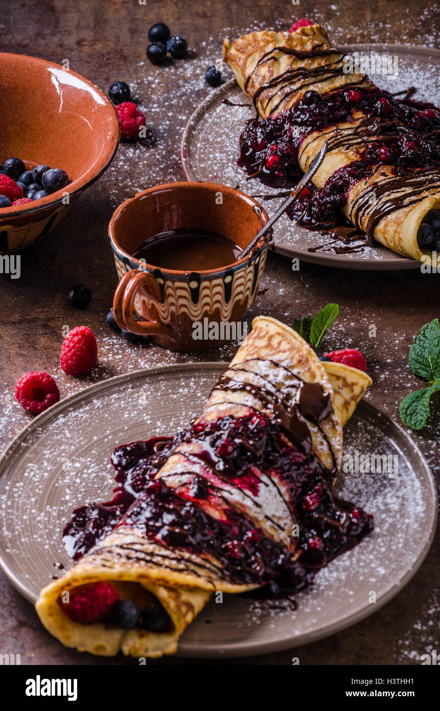 Delicious crepes with forest fruit, topped and filled with forest fruit ...