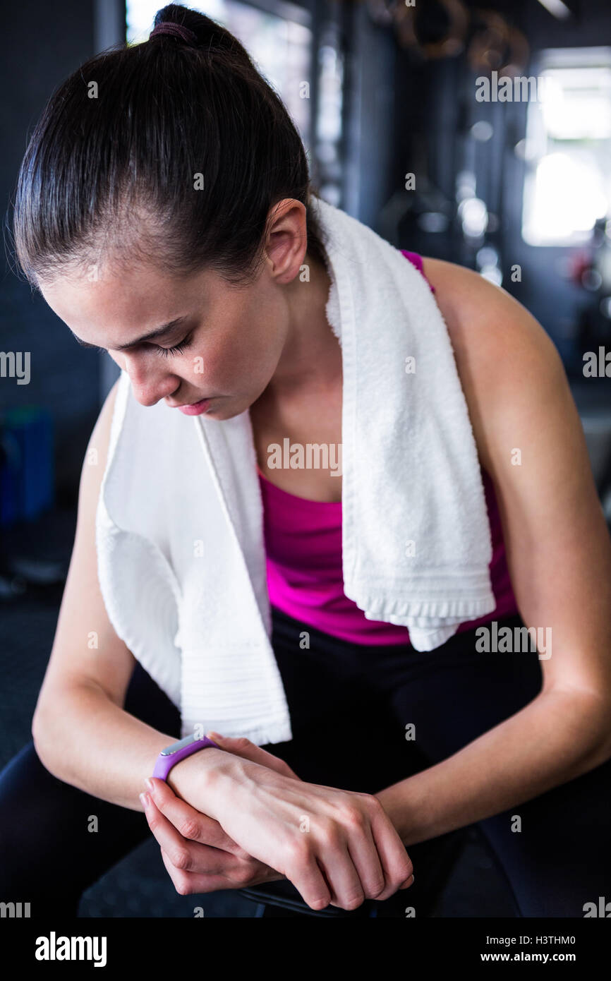 Female athlete checking time in gym Stock Photo - Alamy