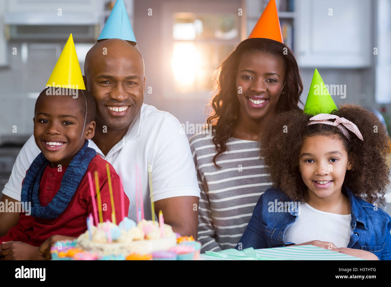 Portrait of family with birthday cake Stock Photo - Alamy