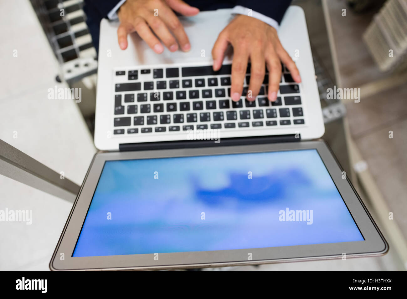 Technician using laptop Stock Photo - Alamy