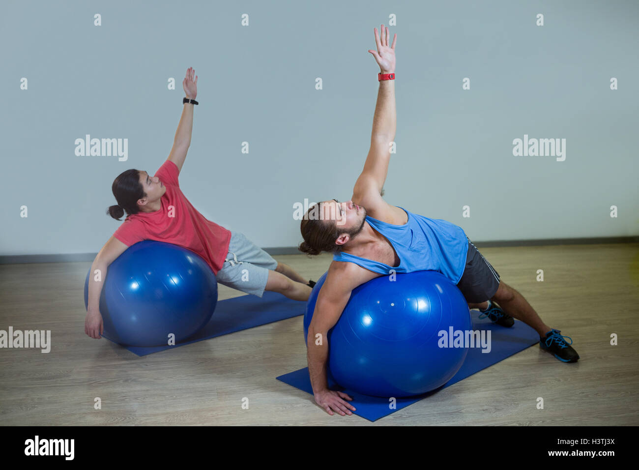 Men exercising with exercise ball Stock Photo - Alamy