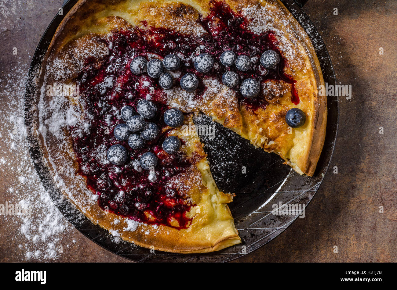 Dutch style pancake named dutch baby, baked in oven on iron skillet ...