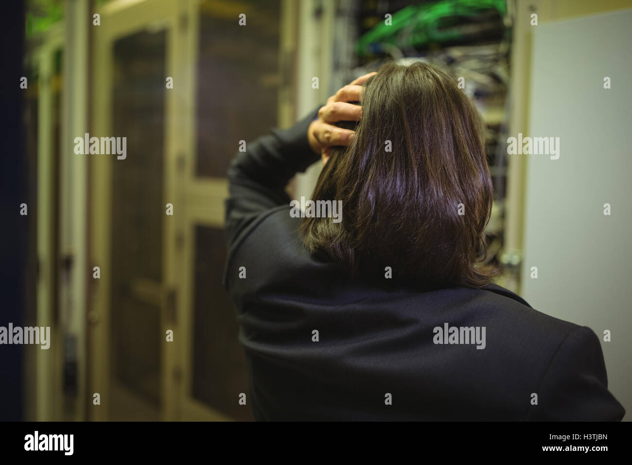 Stressed technician working on server maintenance Stock Photo - Alamy