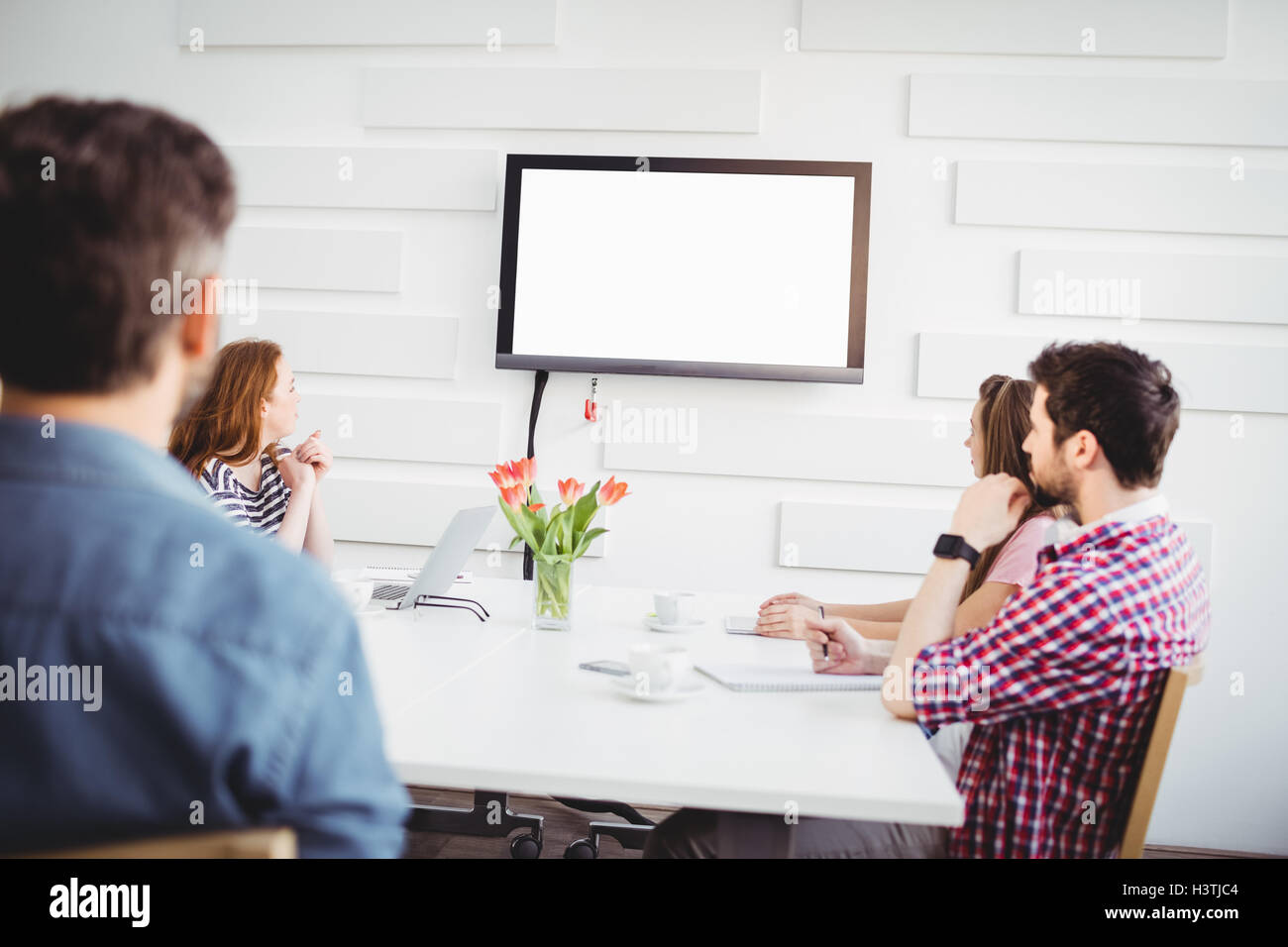 Woman working man watching tv hi-res stock photography and images - Alamy