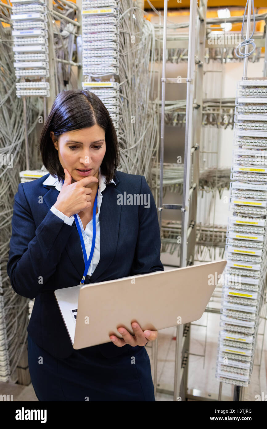 Technician working on laptop Stock Photo - Alamy