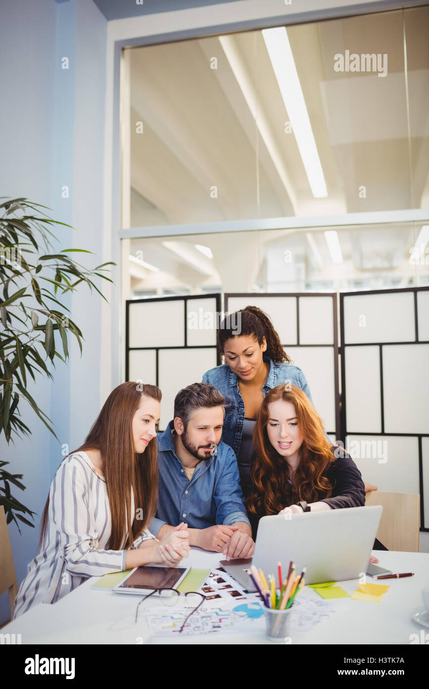 Stylish business people using laptop in meeting room Stock Photo - Alamy