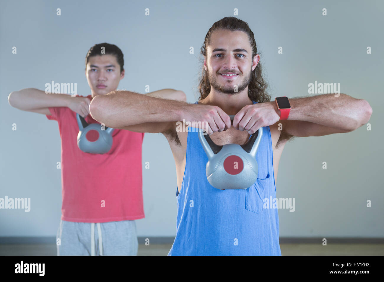 Handsome men exercising in gym hi-res stock photography and images - Alamy