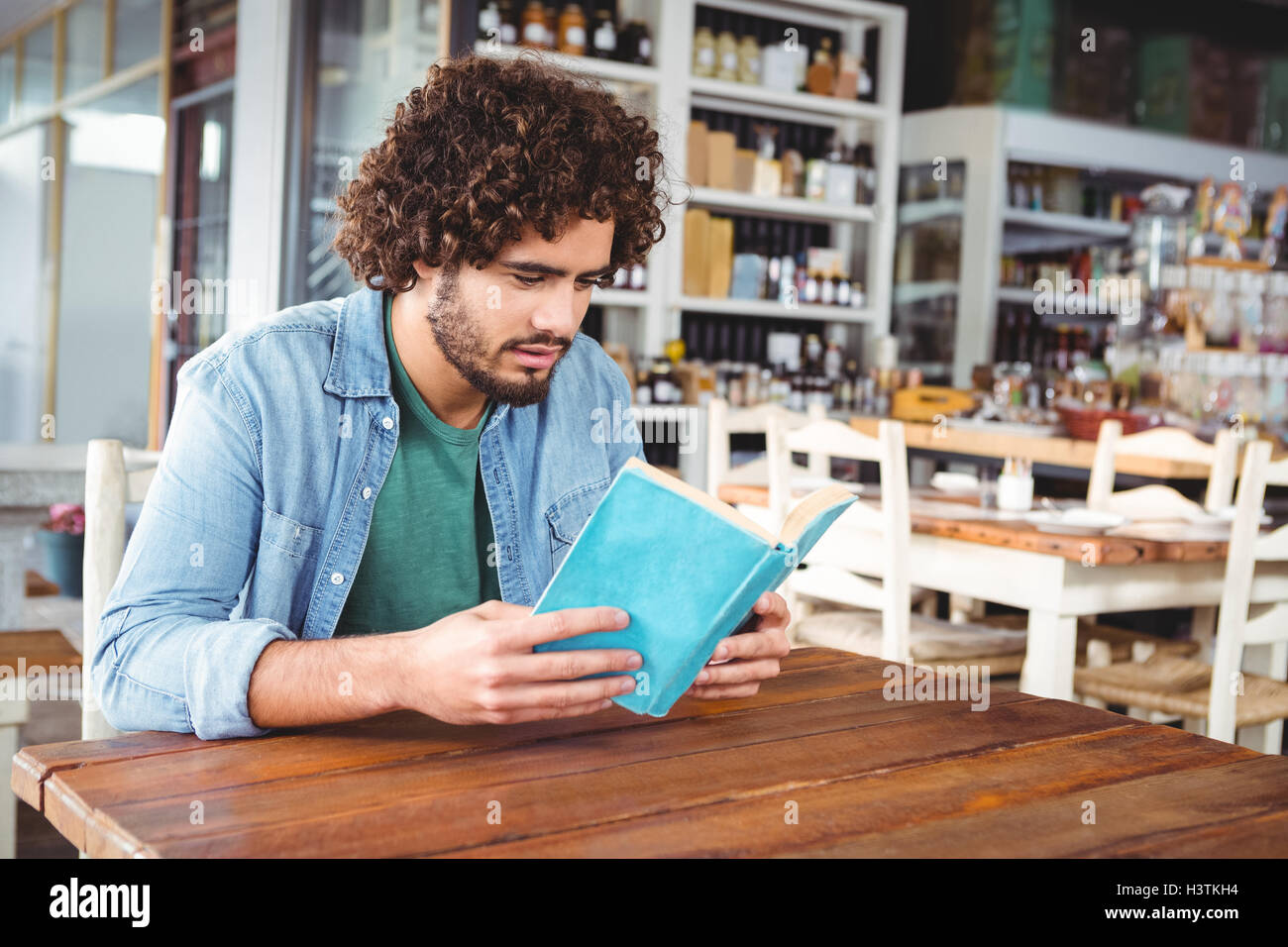 Man reading a book Stock Photo - Alamy