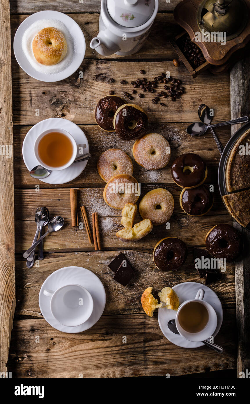 Old style donuts with sugar and dark chocolate, whole table, place for ...