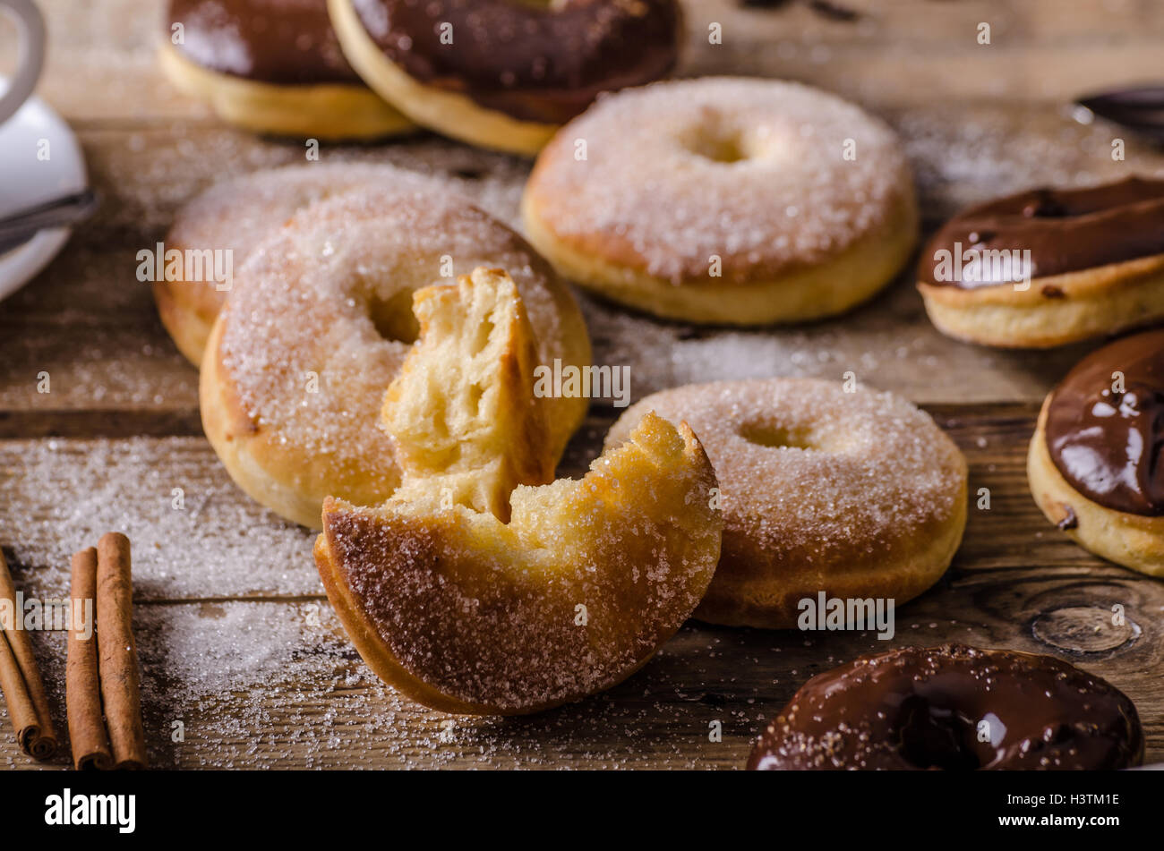 Old style donuts with sugar and dark chocolate, whole table, place for ...